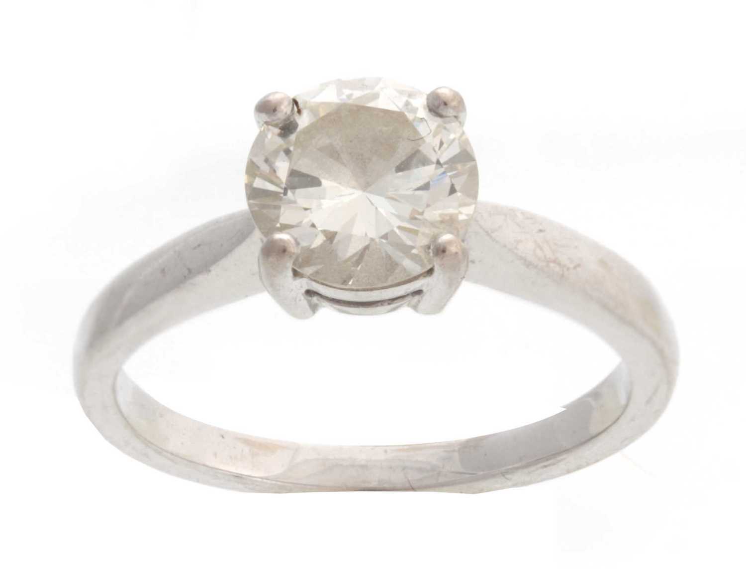 Lot 659 - A .750 WHITE GOLD SQUARE CLAW SET SOLITAIRE