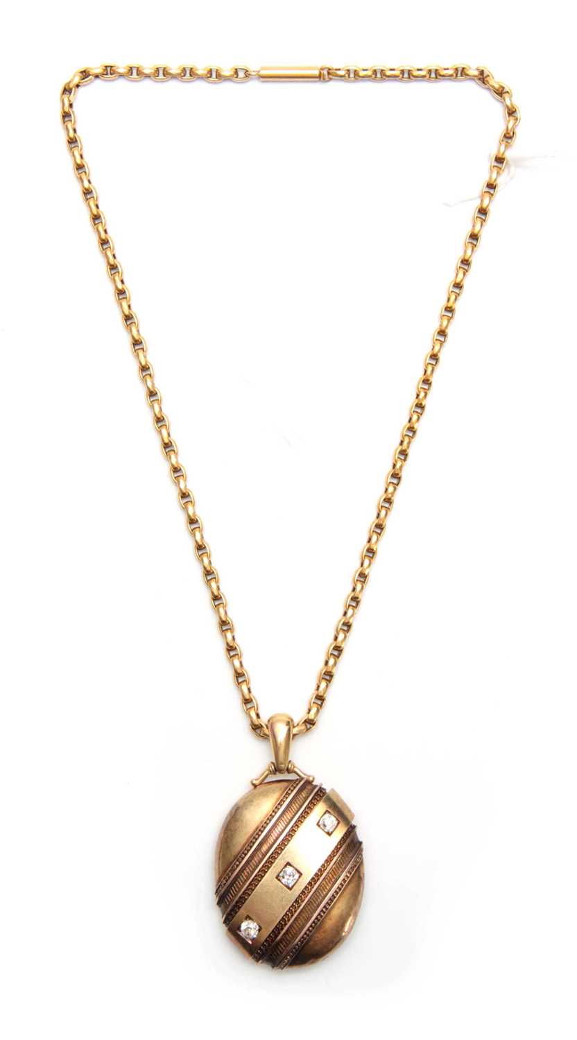 Lot 737 - A VICTORIAN LARGE OVAL LOCKET AND NECK CHAIN