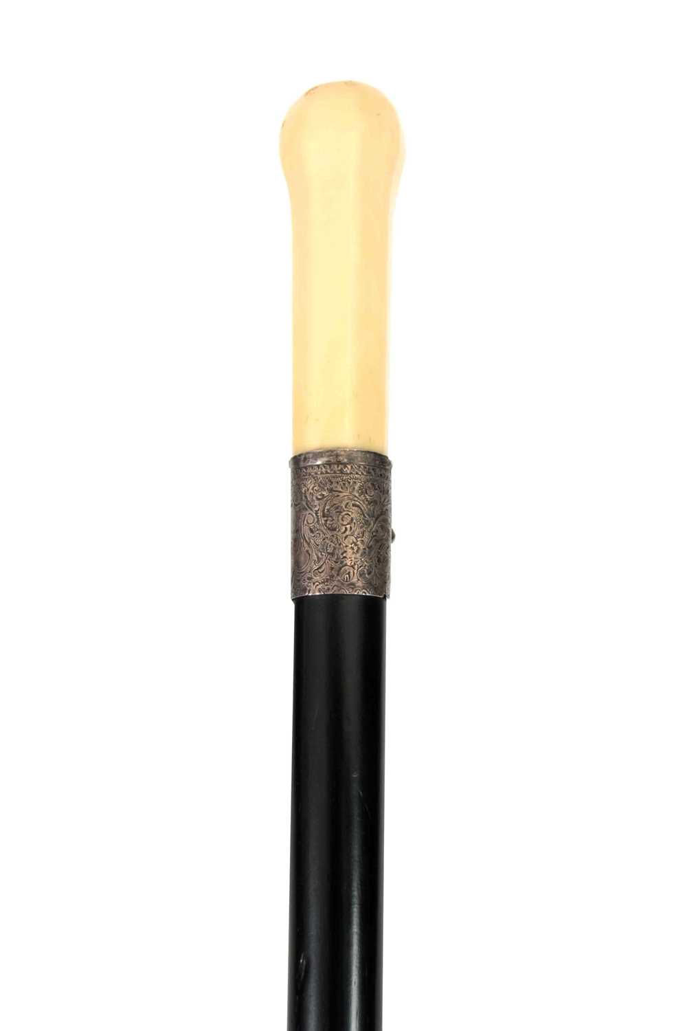 Lot 345 - A 19TH CENTURY EBONY AND IVORY SWORD STICK