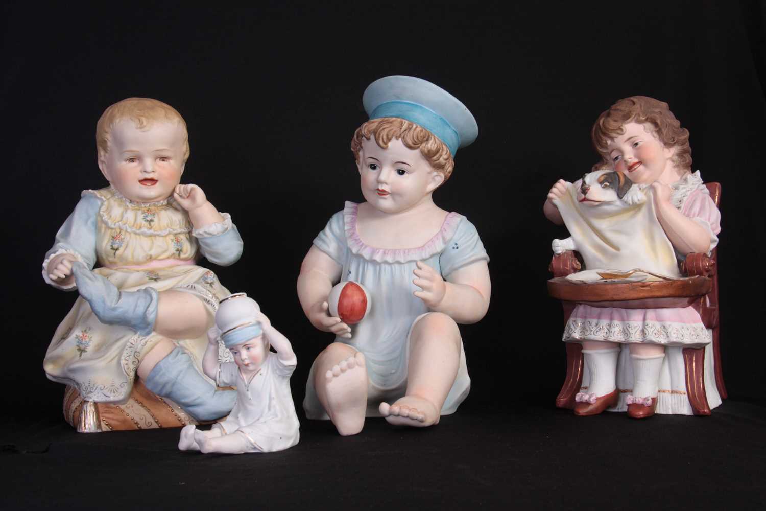 Lot 76 - A LARGE KPM BISQUE FIGURE depicting a seated