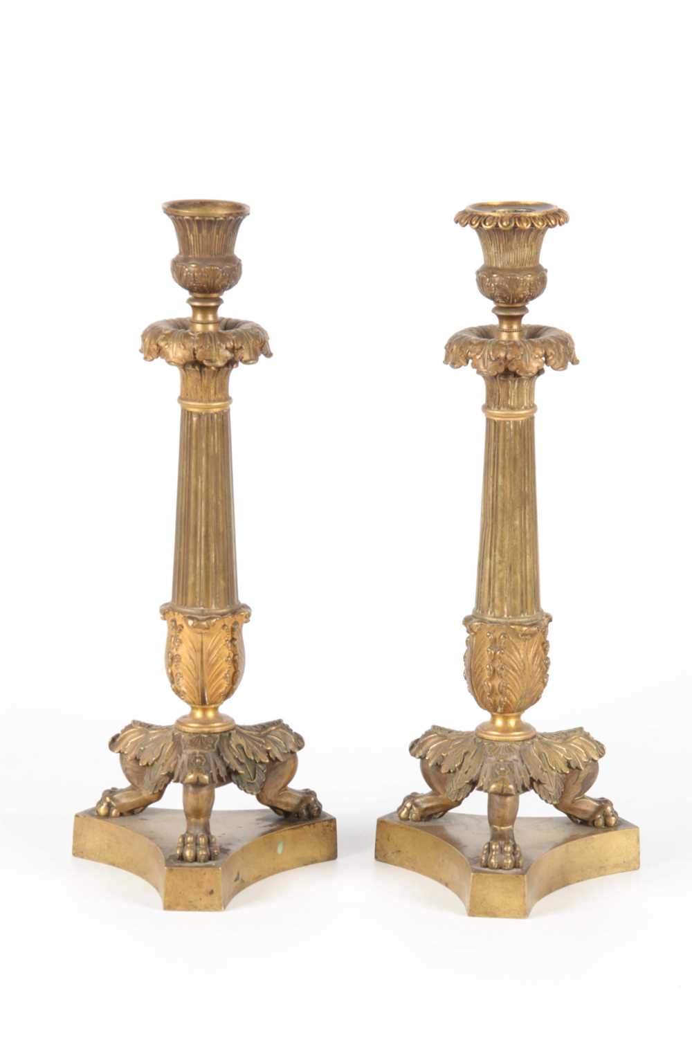 Lot 406 - A PAIR OF REGENCY BRASS CANDLESTICKS with