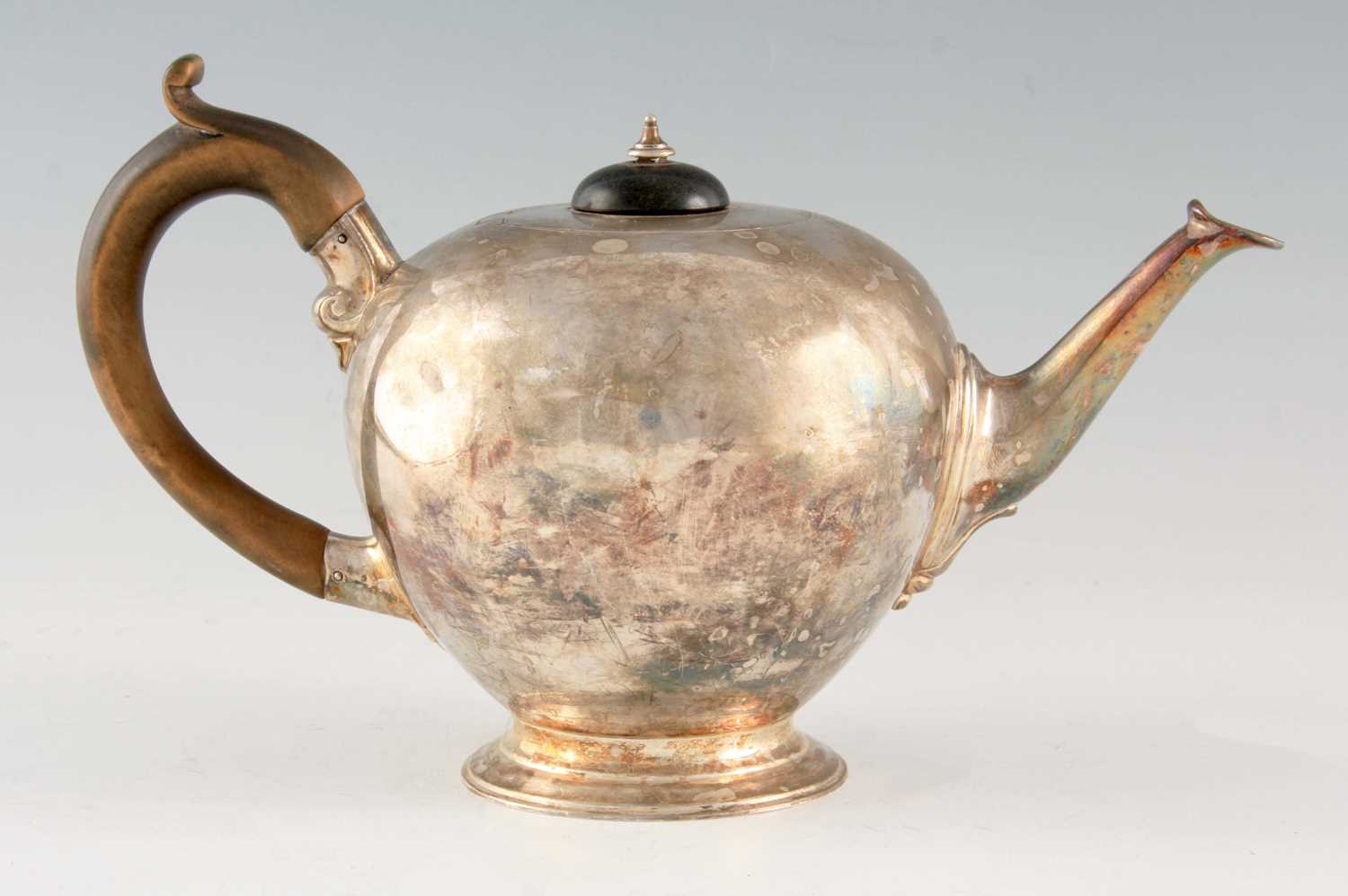 Lot 264 - A VICTORIAN SILVER TEAPOT of bulbous form