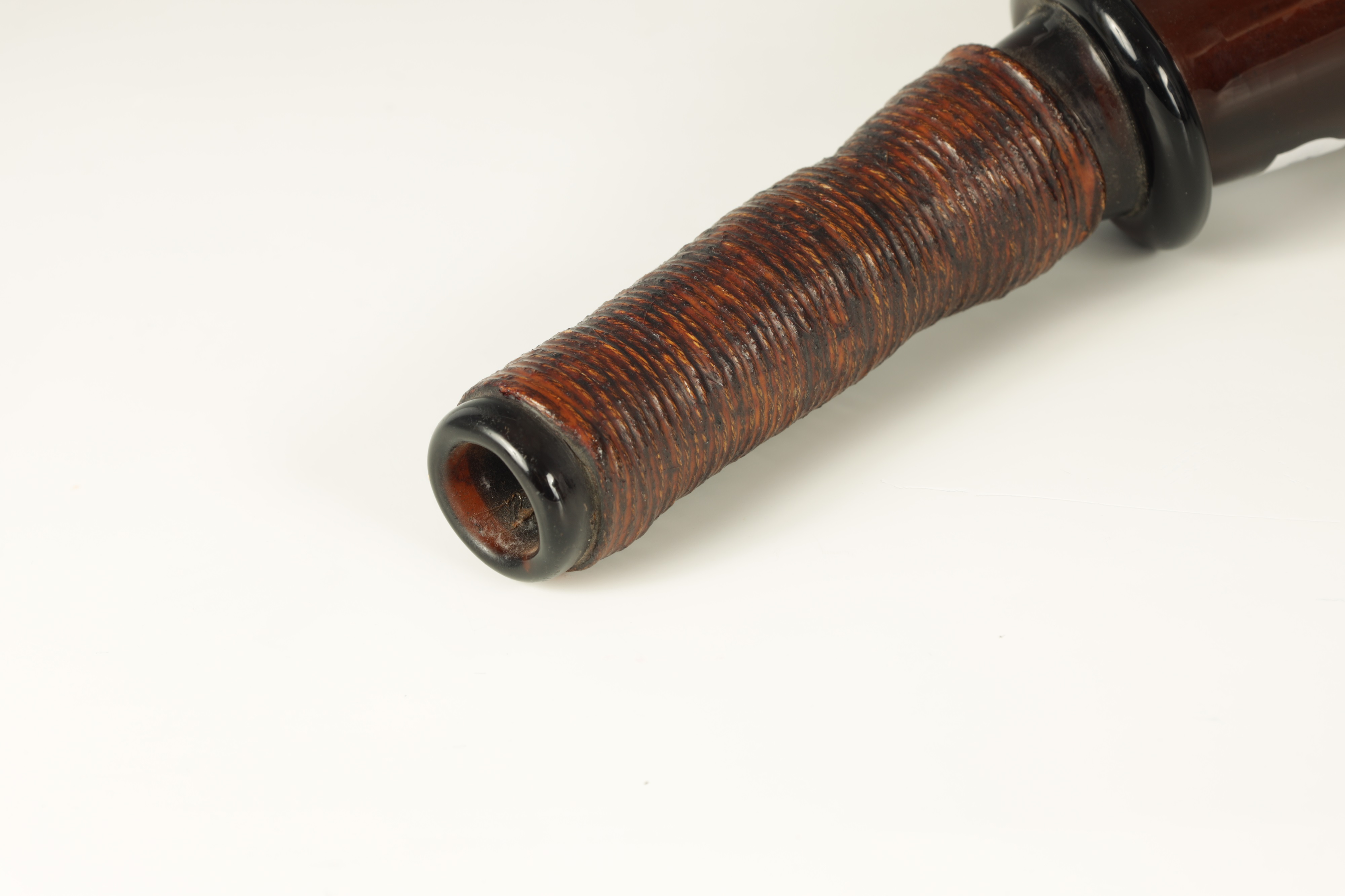 Lot 362 - AN 18TH CENTURY AMBER GLASS POWDER FLASK