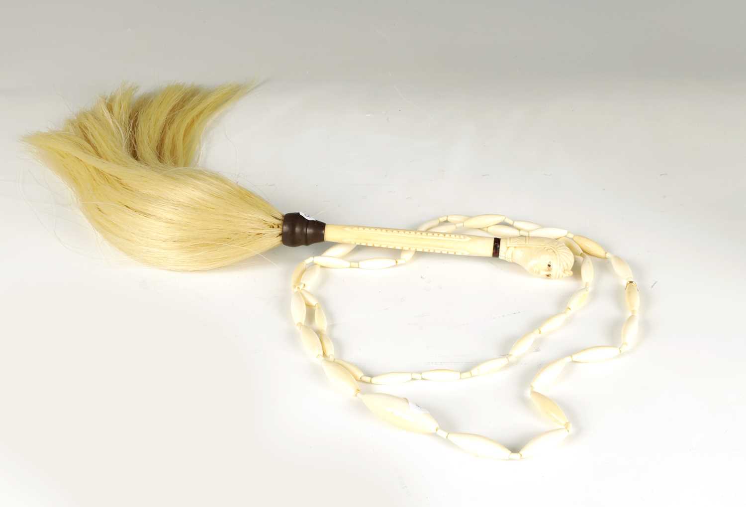 Lot 465 - A 19TH CENTURY CARVED IVORY MASK HEAD