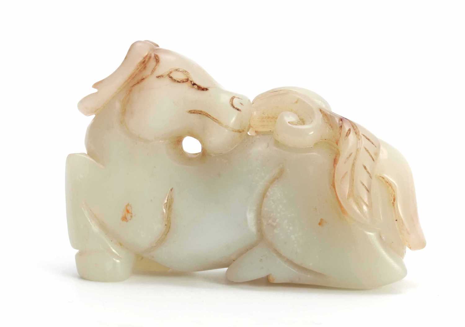 Lot 143 - A CHINESE GREEN RUSTED JADE SCULPTURE OF A