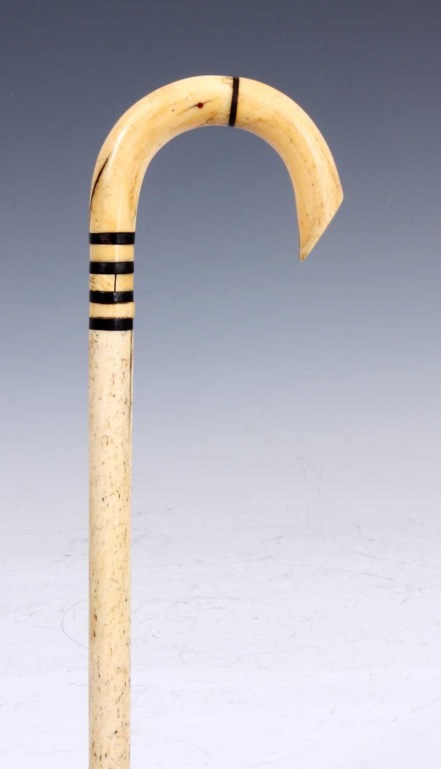 Lot 221 - A 19TH CENTURY WHALEBONE WALKING CANE with