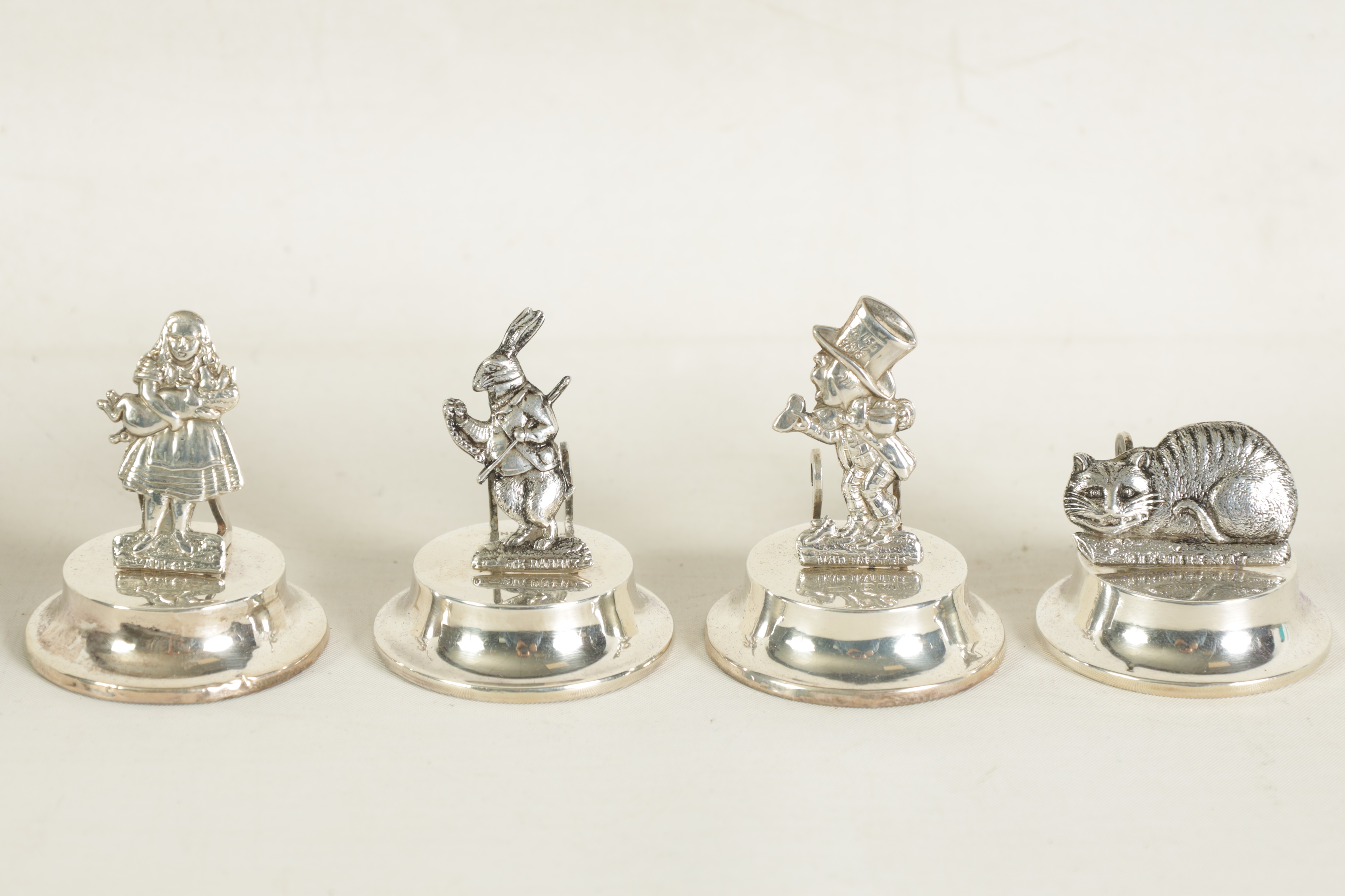 Lot 351 - A CASED SET OF FOUR SILVER 'ALICE IN