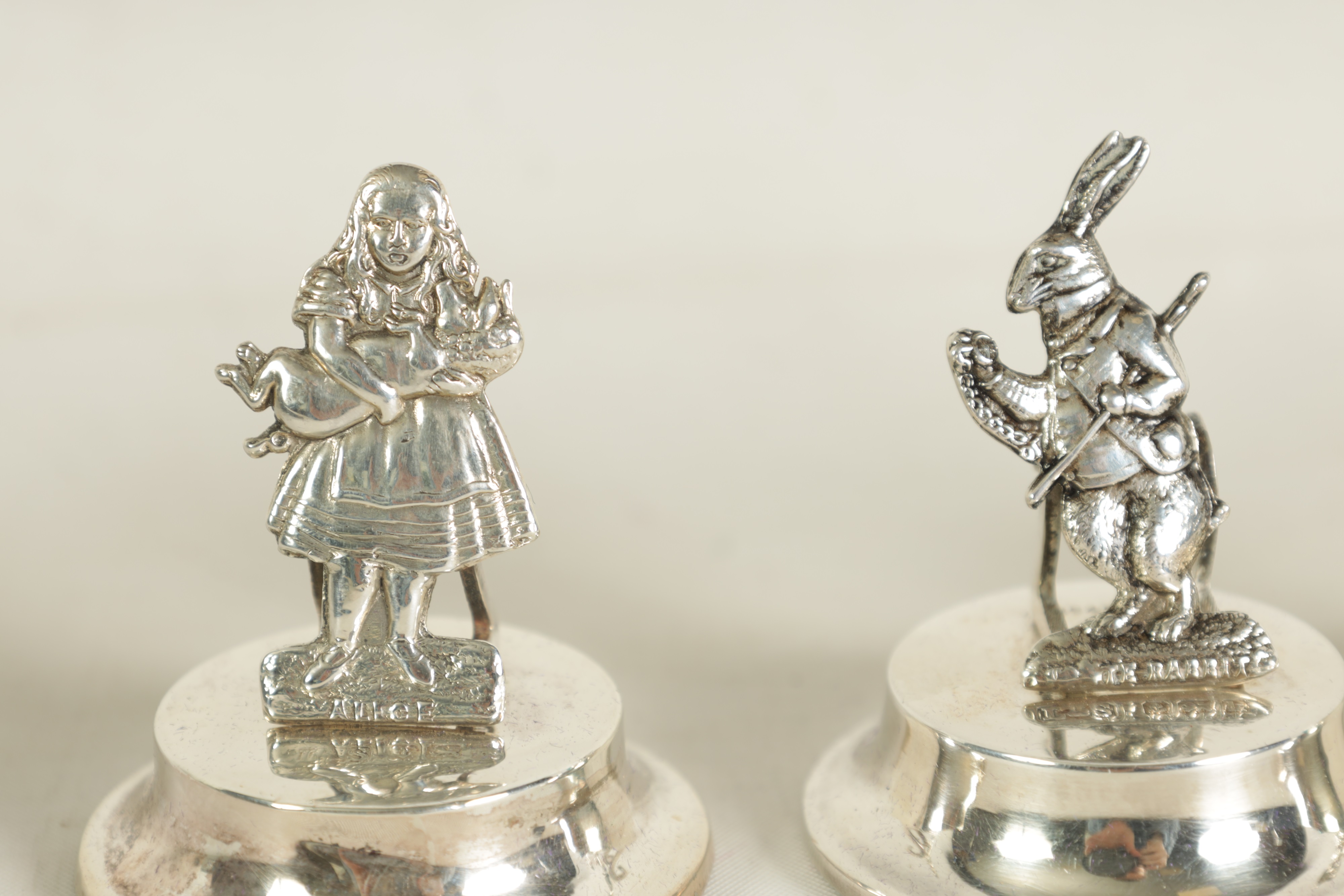 Lot 351 - A CASED SET OF FOUR SILVER 'ALICE IN