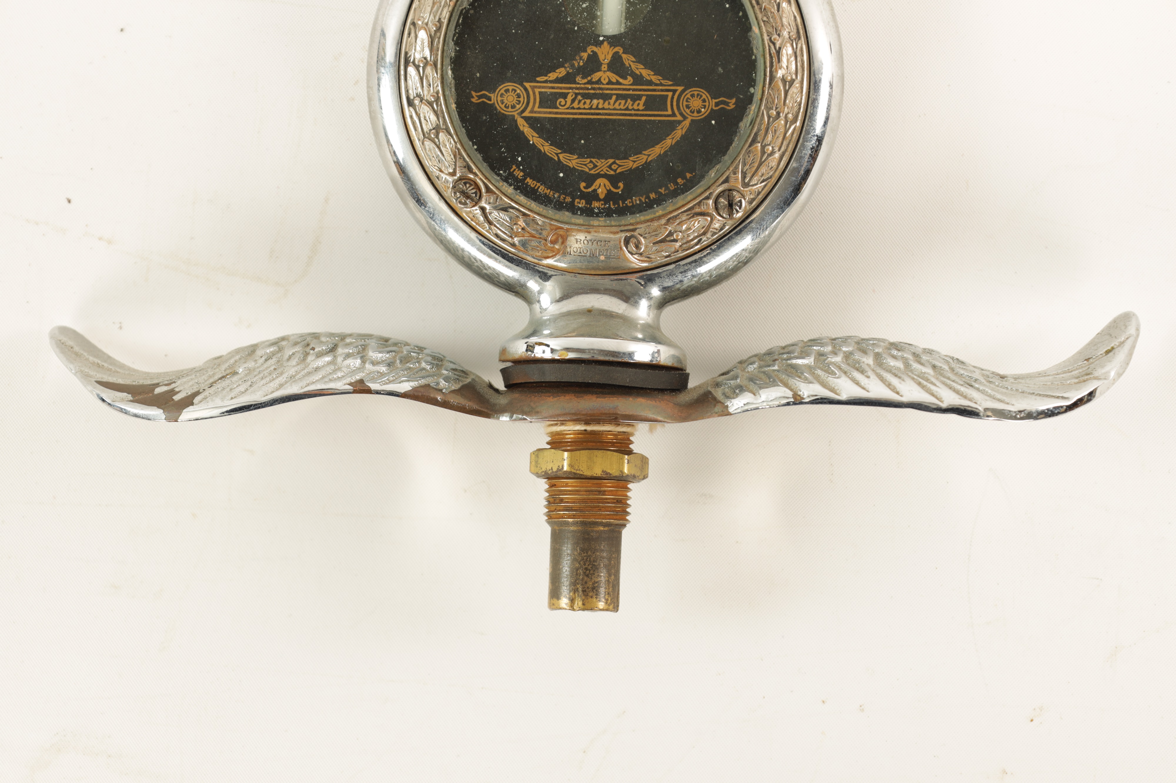 Lot 73 - A WINGED BOYCE MOTO METER RADIATOR CAP/CAR