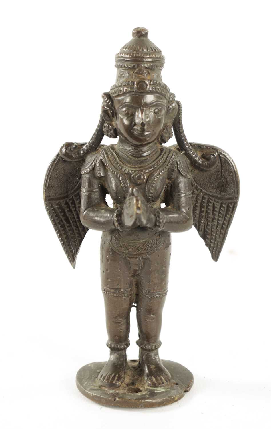 Lot 142 - AN EARLY INDIAN CAST BRONZE FIGURE OF A