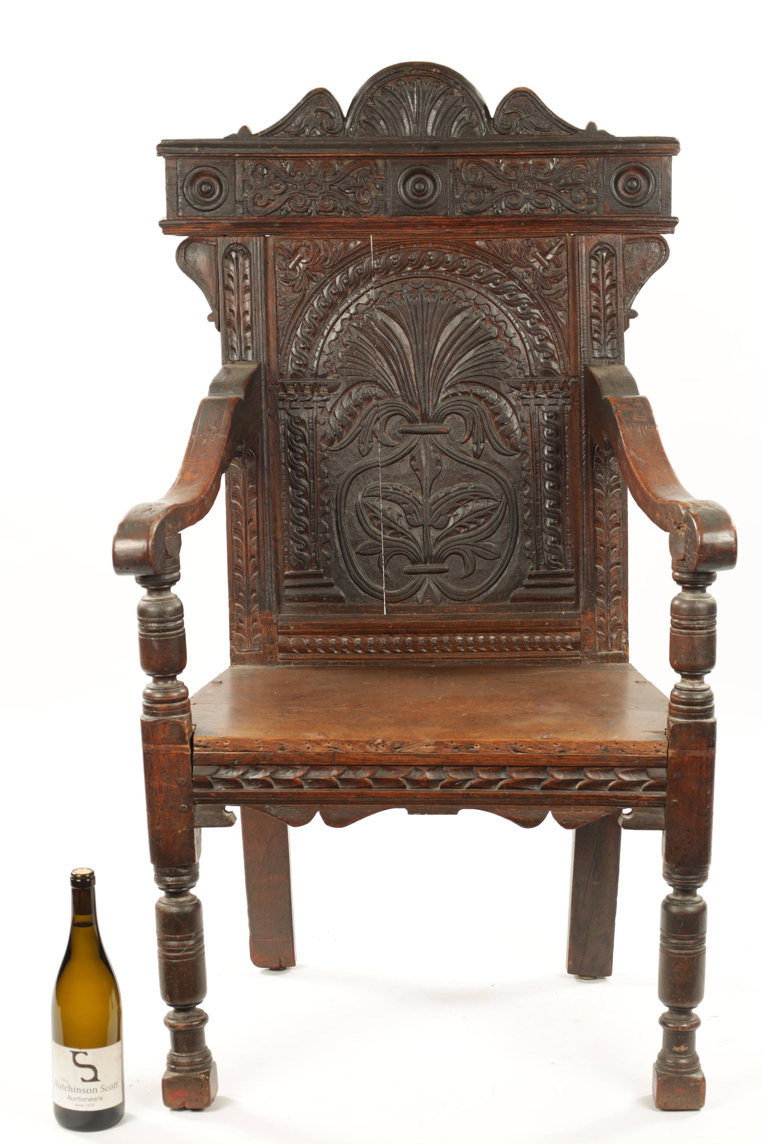 Lot 55 - A 17TH CENTURY CARVED OAK WAINSCOT CHAIR