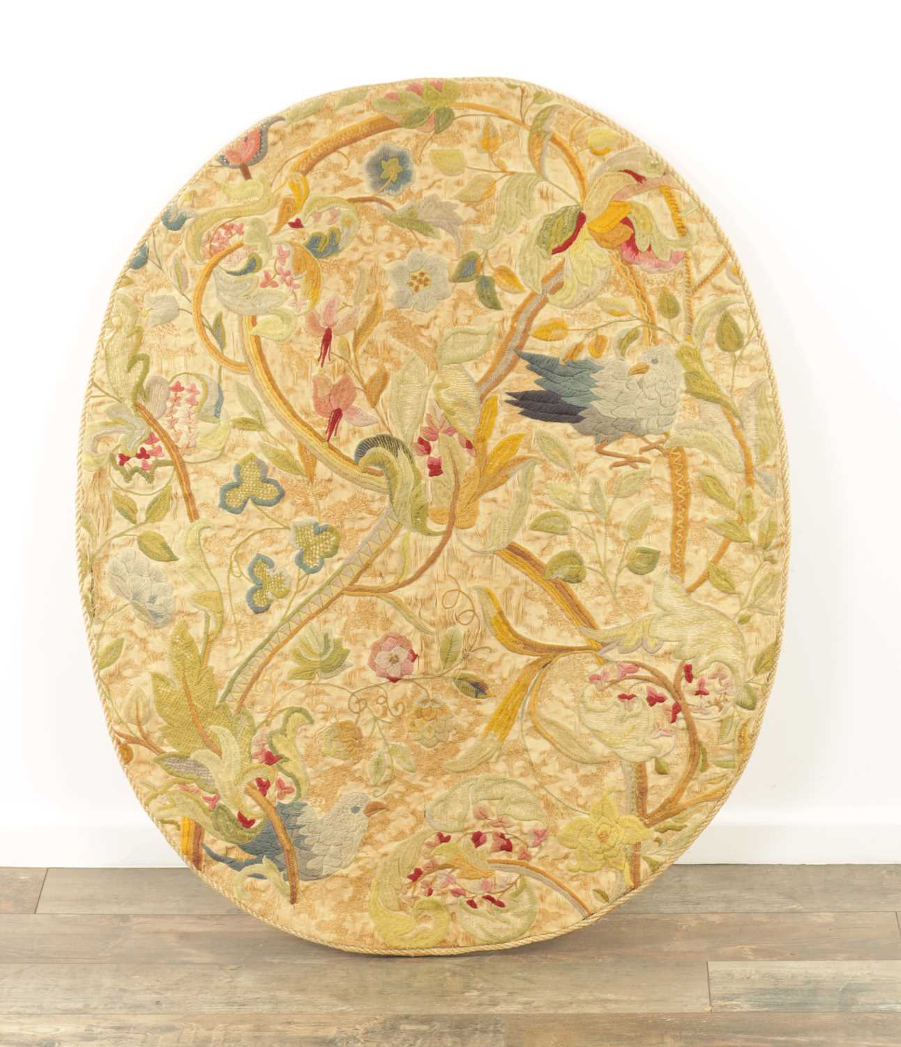Lot 673 - AN 18TH CENTURY EMBROIDERED OVAL PANEL