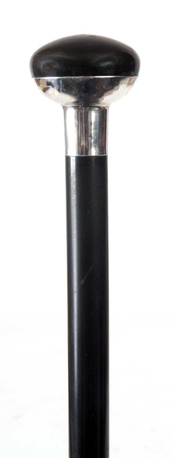 Lot 227 - AN UNUSUAL BAKELITE AND SILVER WALKING CANE