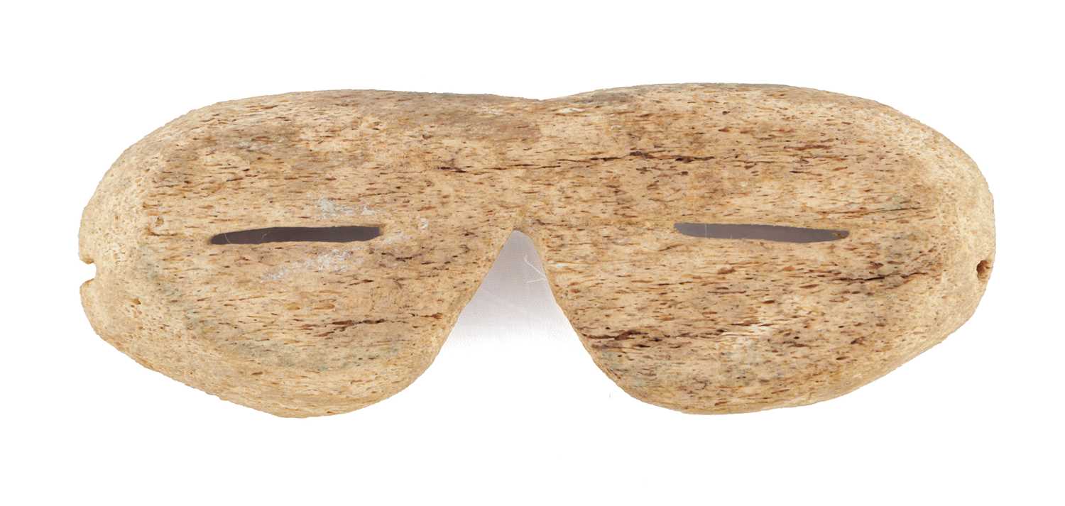 Lot 882 - A PAIR OF CARVED BONE INUIT SNOW GOGGLES