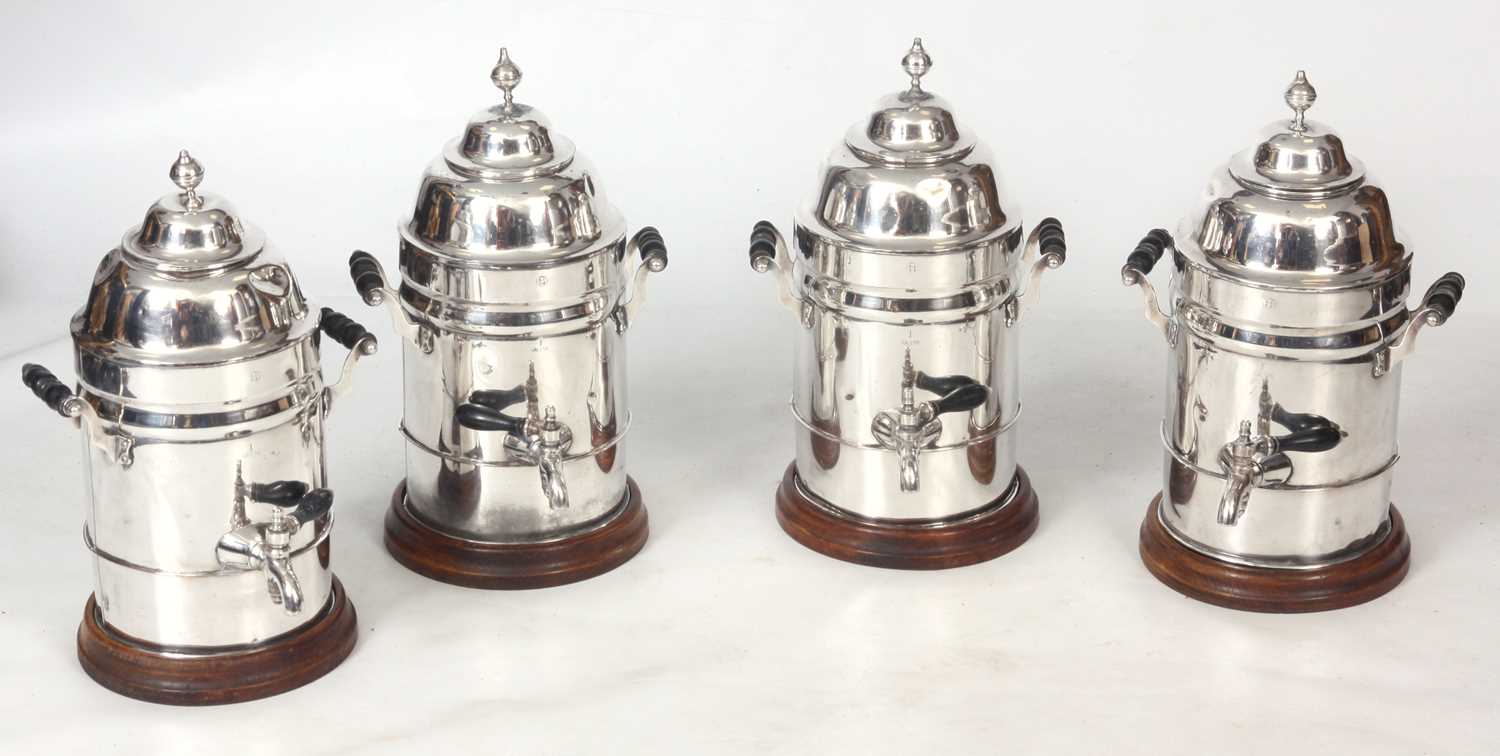 Lot 326 - A SET OF FOUR SILVER PLATED TEA URNS with