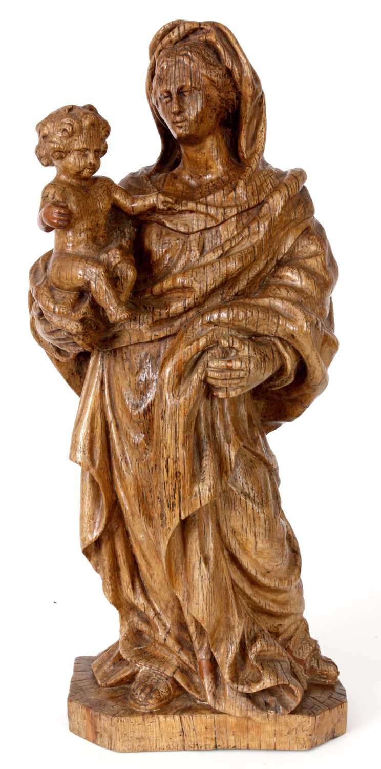 Lot 357 - A GOOD 17TH CENTURY CARVED ELM FIGURE OF