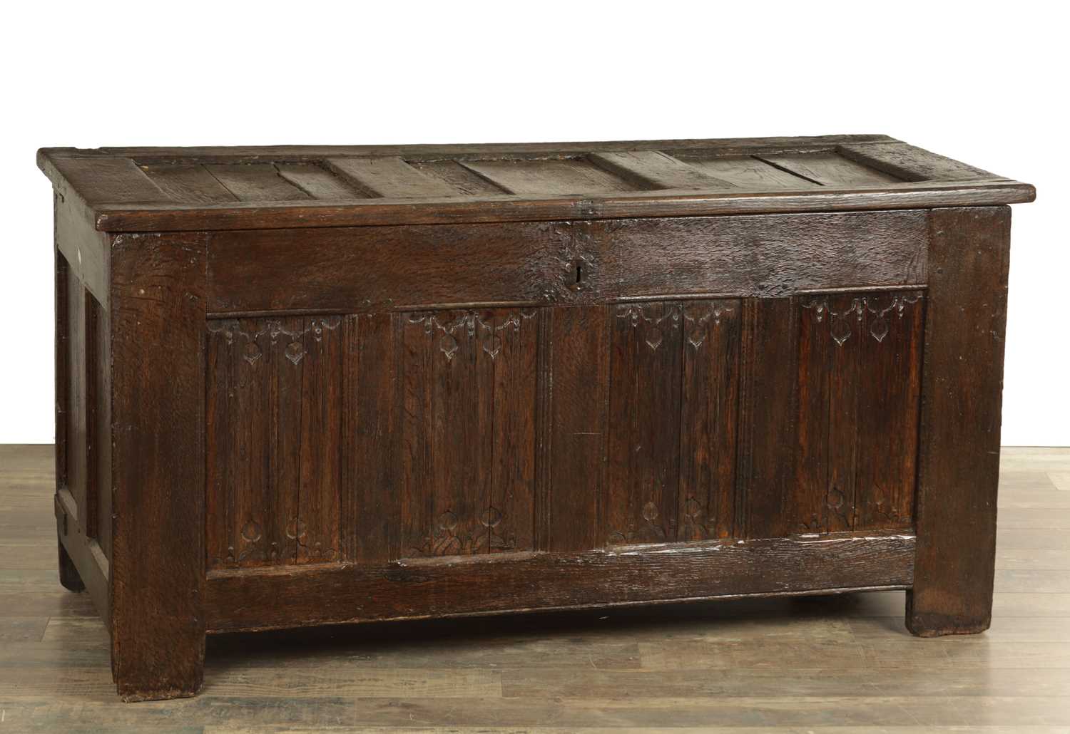 A 17TH CENTURY JOINED OAK PANELLED LINEN FOLD COFFER