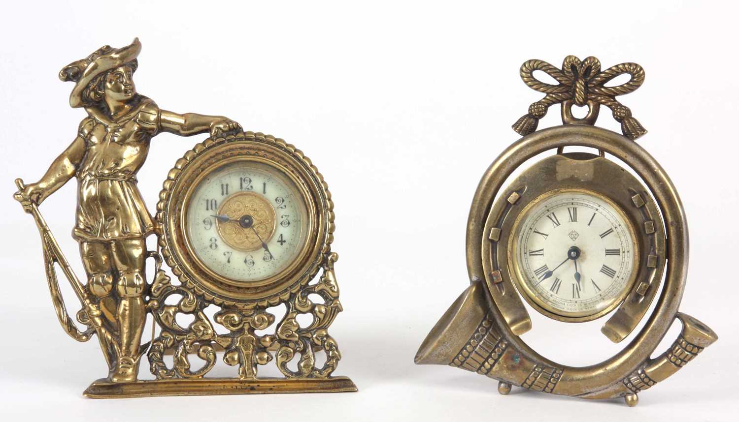 Lot 130 - TWO BRASS FRAMED STRUT CLOCKS one with a