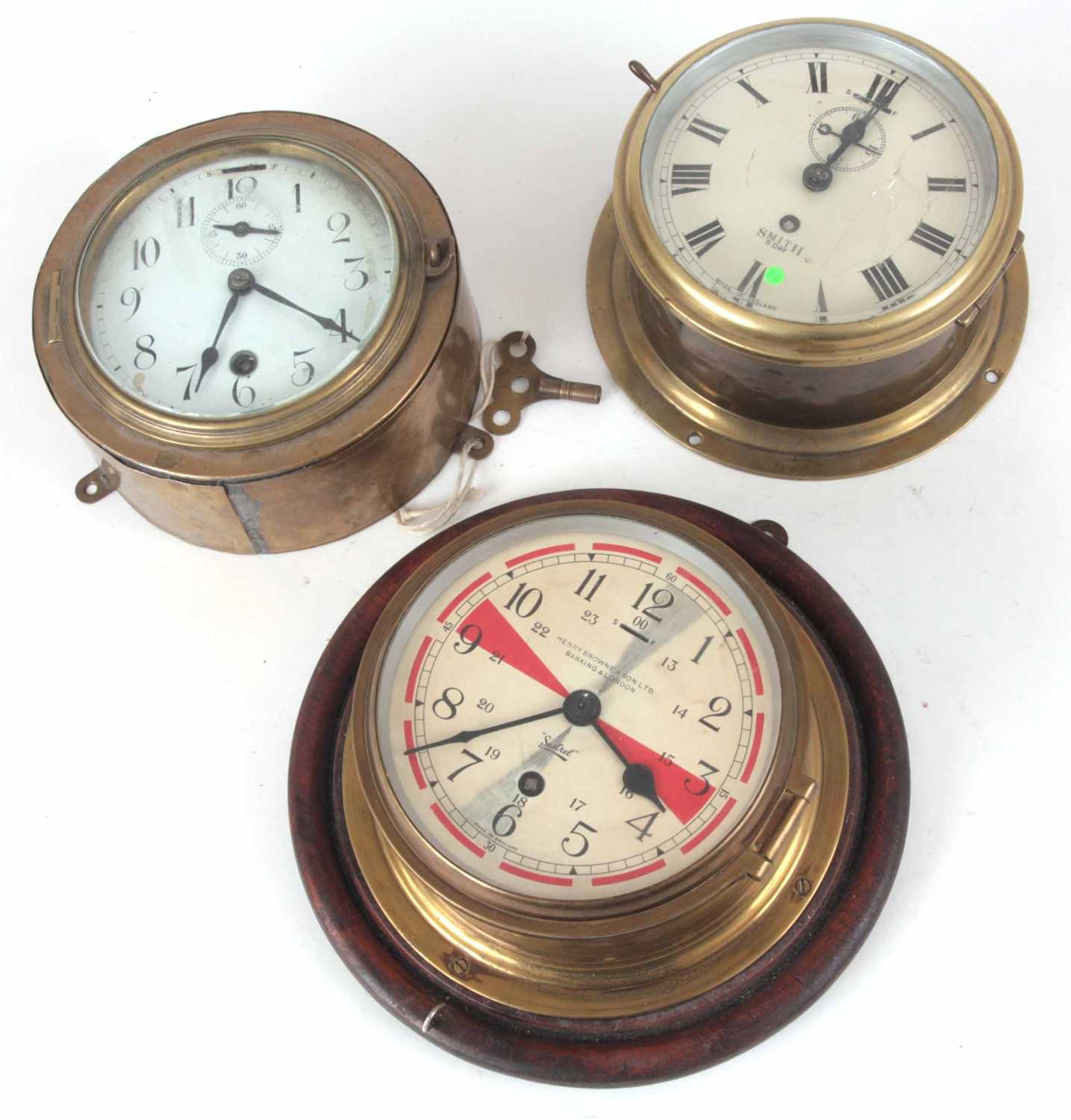 Lot 186 - THREE BRASS SHIPS CLOCKS one Henry Brown