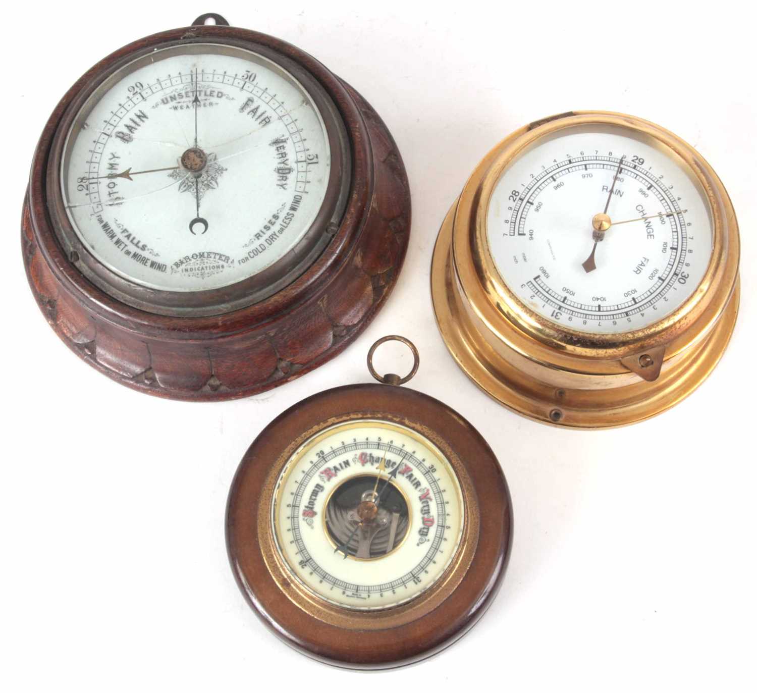 Lot 205 - THREE ANEROID BAROMETERS one brass cased
